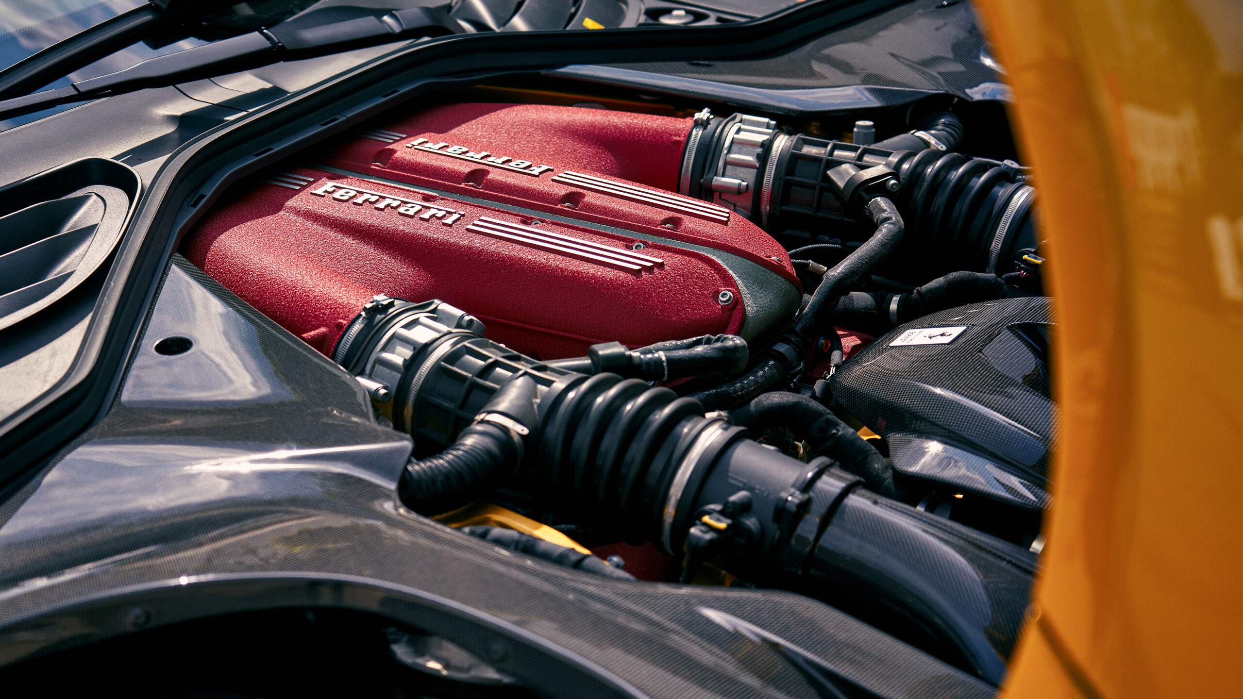 Why does Ferrari still prefer V12 engines in 2025?